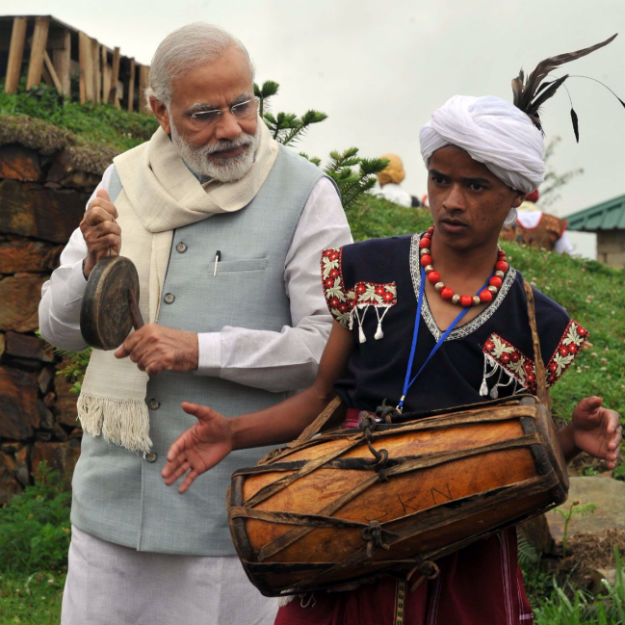 Prime Minister Narendra Modi tries his hand at drums in Mawphlang, Asia ...